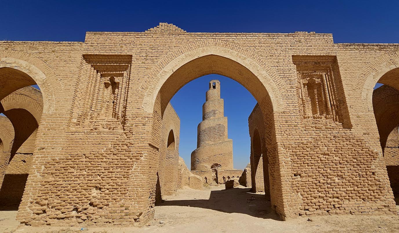 Climbing the scary spiral minaret of Abu dulaf. - Silver Queer Travel light